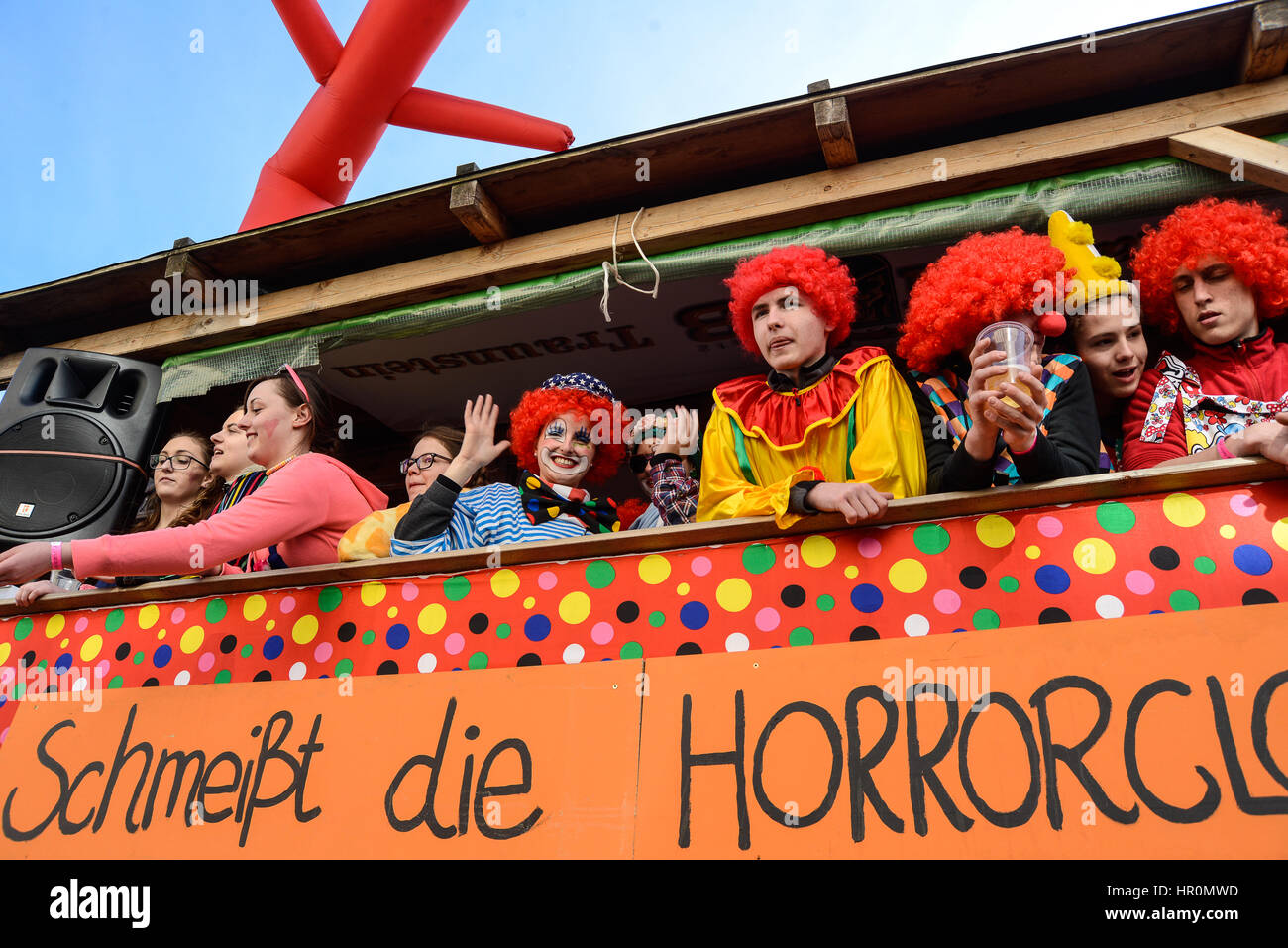 Neuoetting, Germany-February 25, 2017: Woman dressed up as clown waves ...