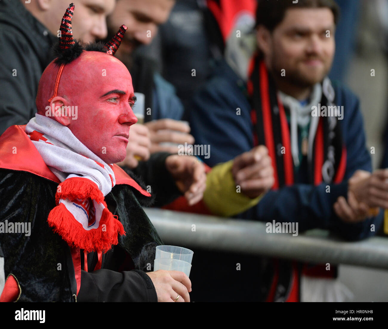 An SC Fan dressed as a devil standing disappointed after the match at ...