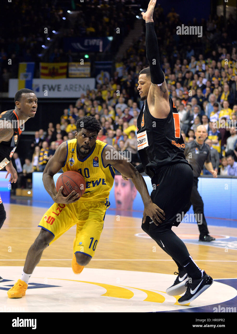 Oldenburg's Frantz Massenat (M) in action against Ulm's Raymar Morgan ...