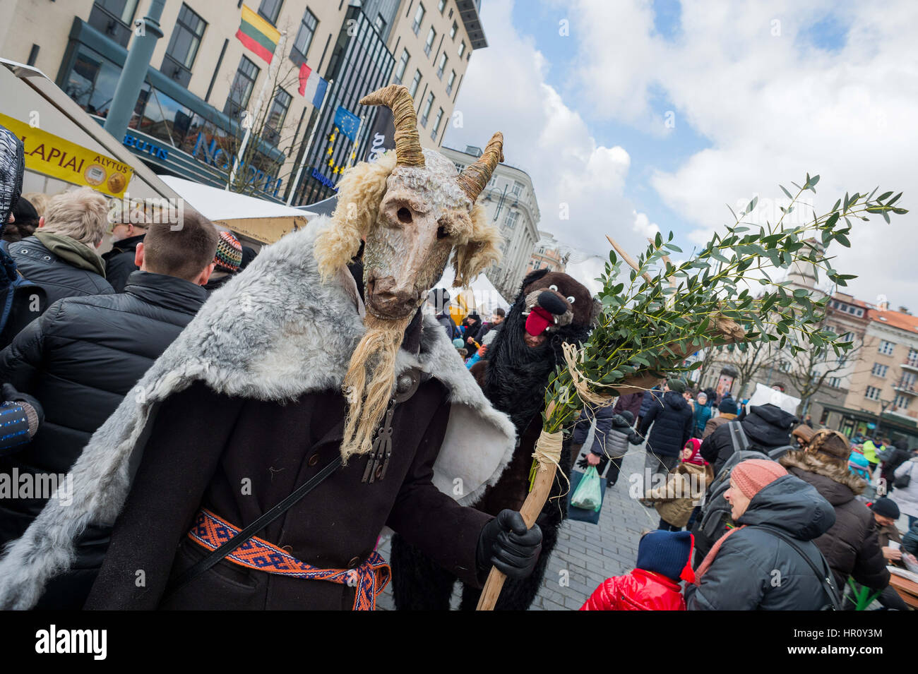 Vilnius. 25th Feb, 2017. Two locals dress up as goat and bear during ...