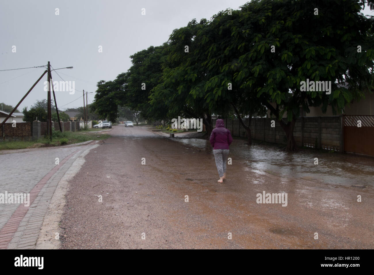Gaborone, Botswana. 25 February, 2017. Woman negotiates surface ...