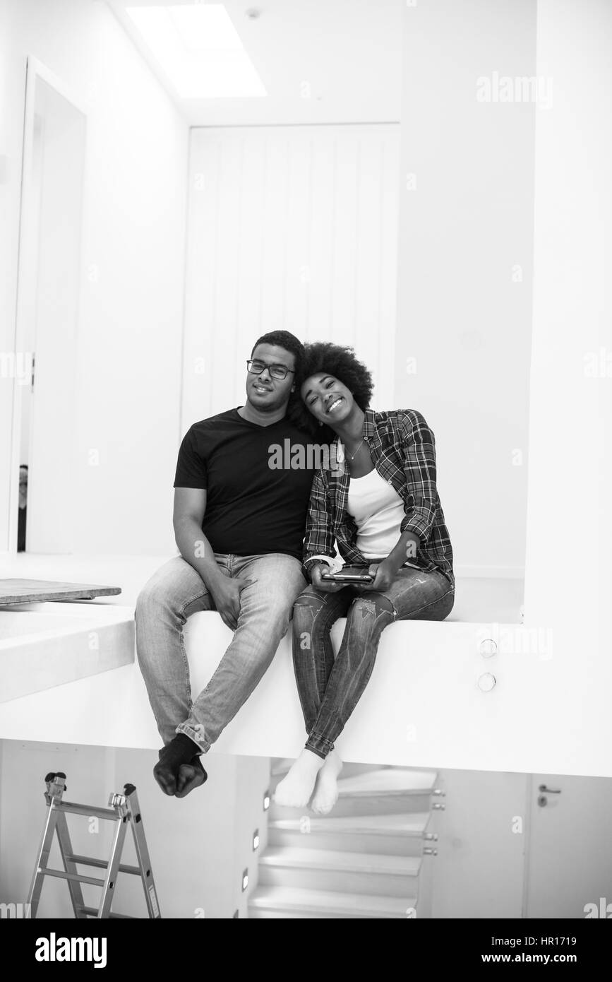 Happy man unpacking boxes Black and White Stock Photos & Images - Alamy