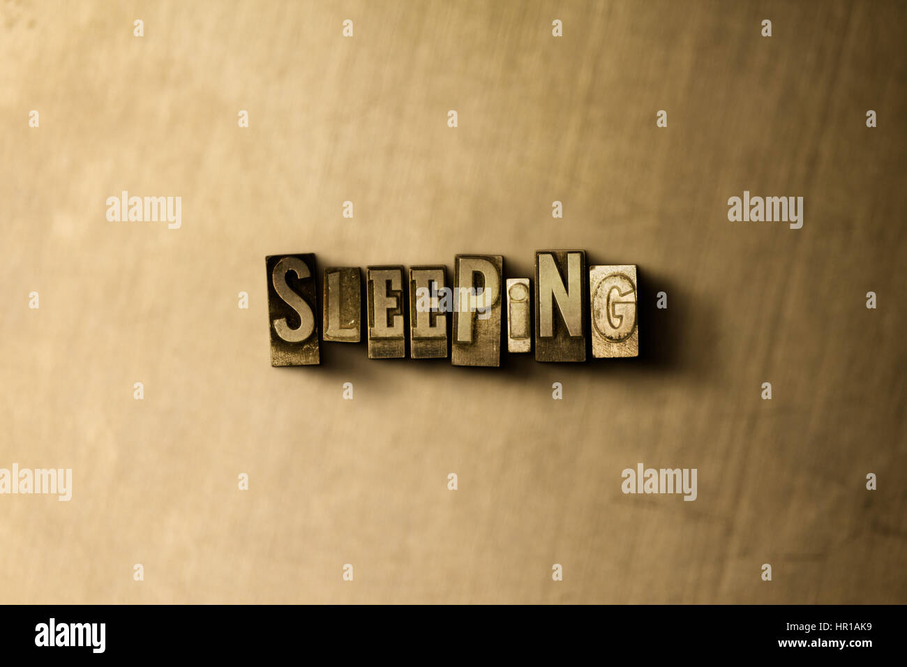 SLEEPING - close-up of grungy vintage typeset word on metal backdrop ...