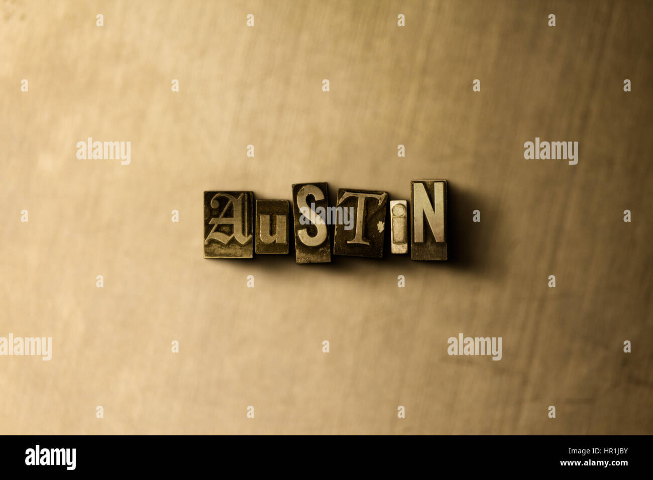 AUSTIN - close-up of grungy vintage typeset word on metal backdrop ...