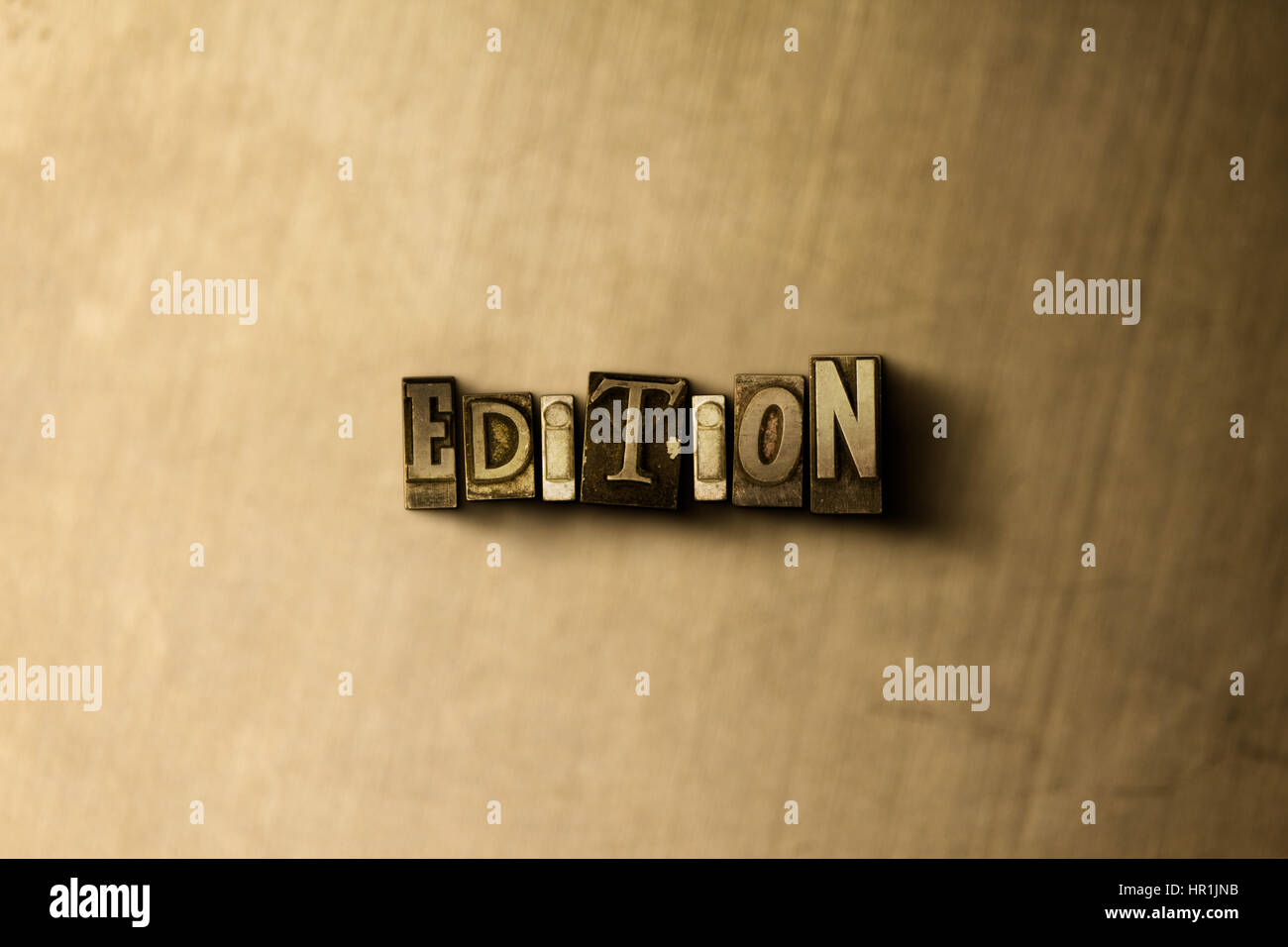 EDITION - close-up of grungy vintage typeset word on metal backdrop ...