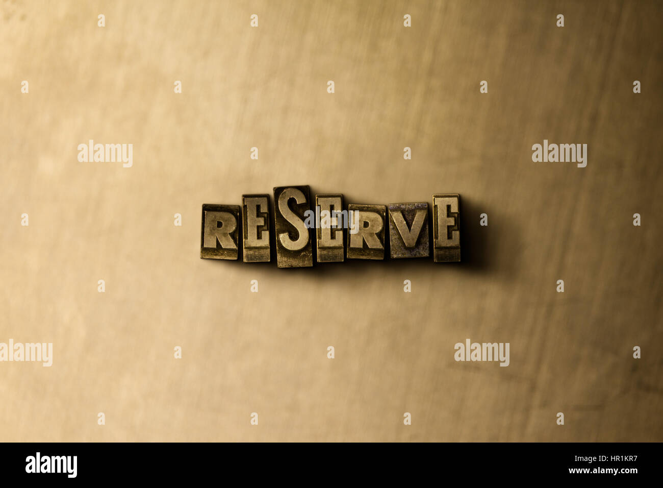 RESERVE - close-up of grungy vintage typeset word on metal backdrop ...