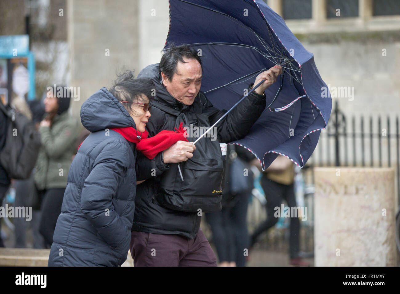 Tourists in cambridge in bad weather Stock Photo - Alamy
