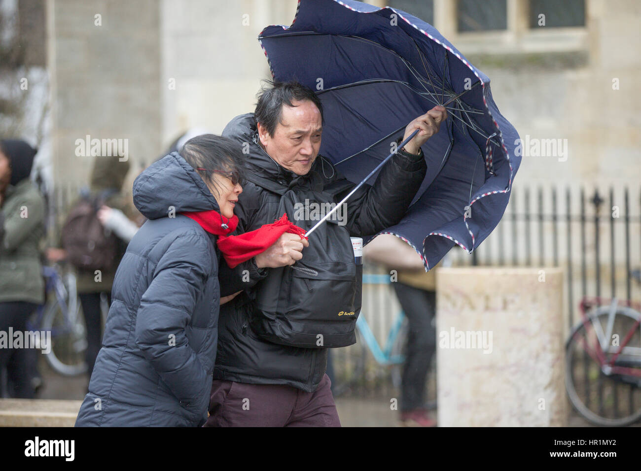 Tourists in cambridge in bad weather Stock Photo - Alamy
