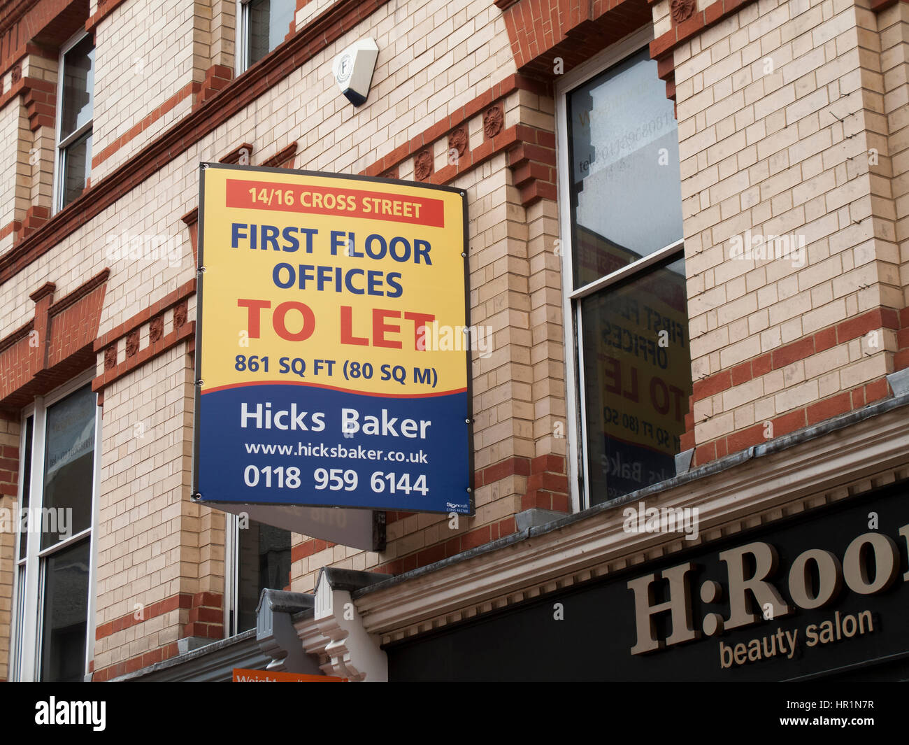 First floor offices to let sign over retail premises with now let ...