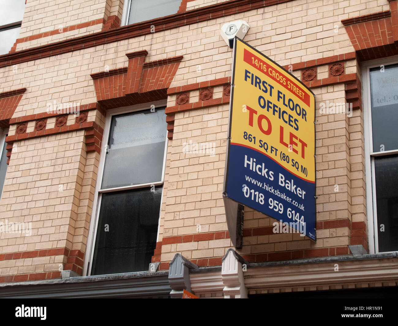 First floor offices to let sign over retail premises with now let ...