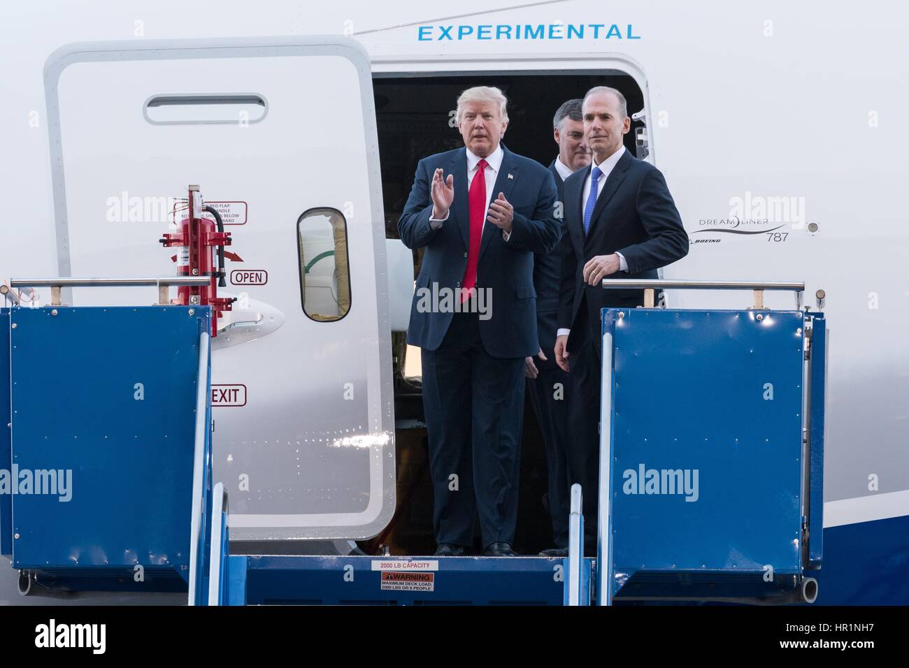 U.S. President Donald Trump stands with Boeing CEO Dennis Muilenburg ...