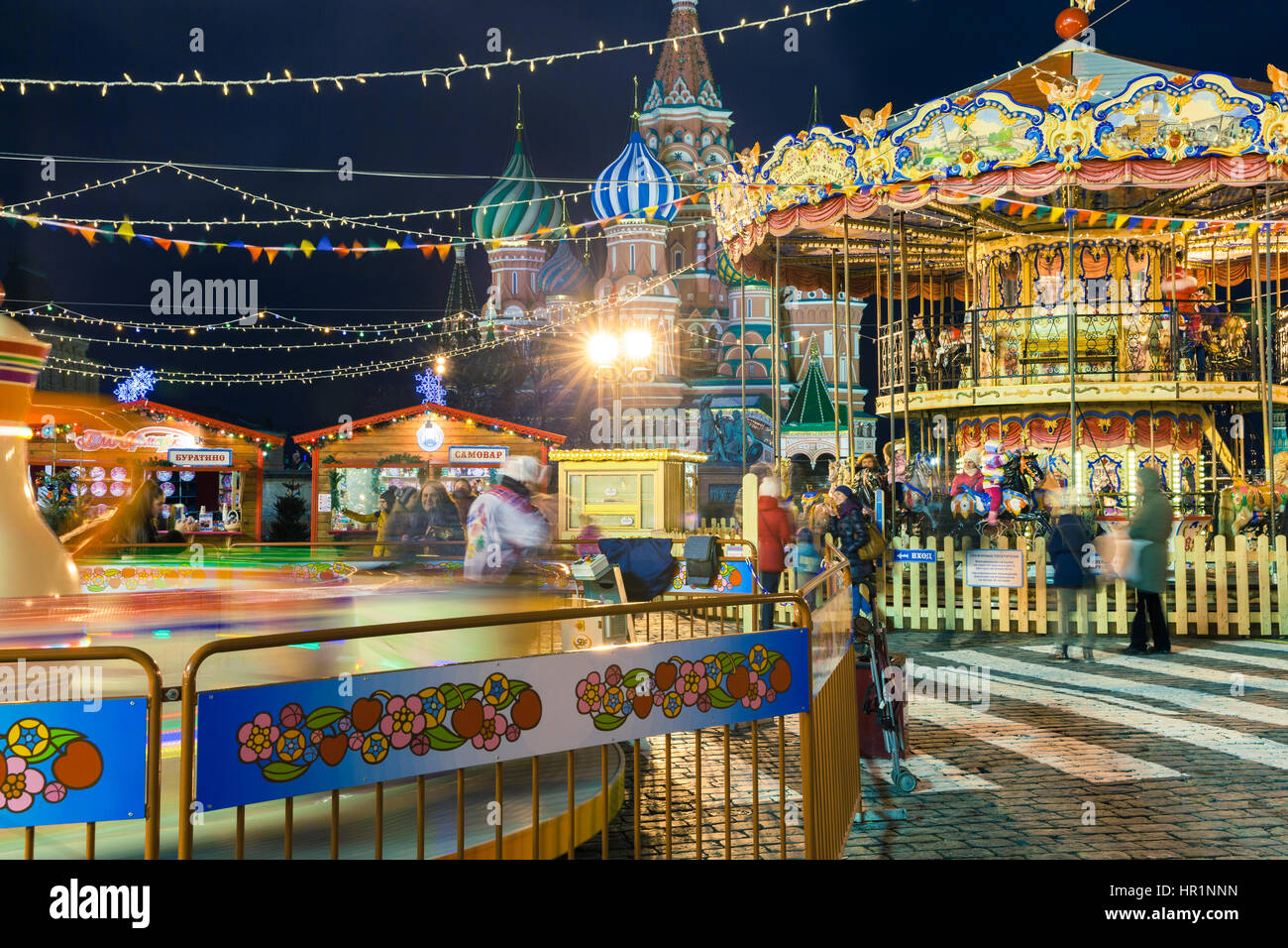Russia, Moscow - 15 January, 2015: People shopping, ride a carousel and ...