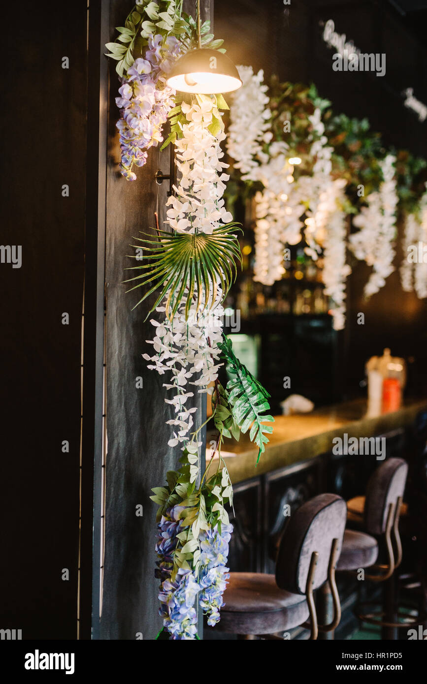 Beautifully decorated with plants bar counter Stock Photo - Alamy