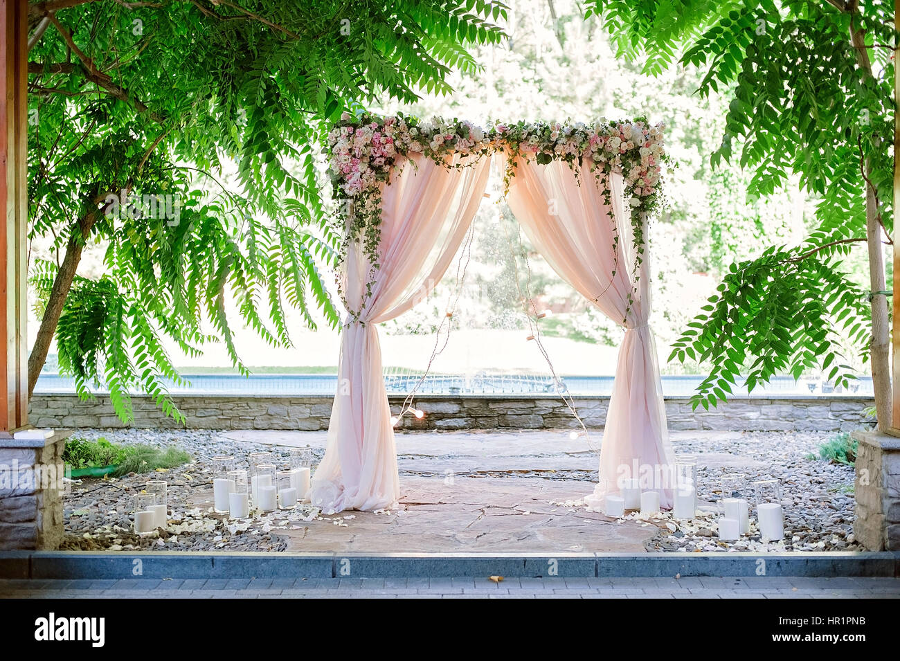 Arch for the wedding ceremony, decorated with cloth and flowers Stock ...