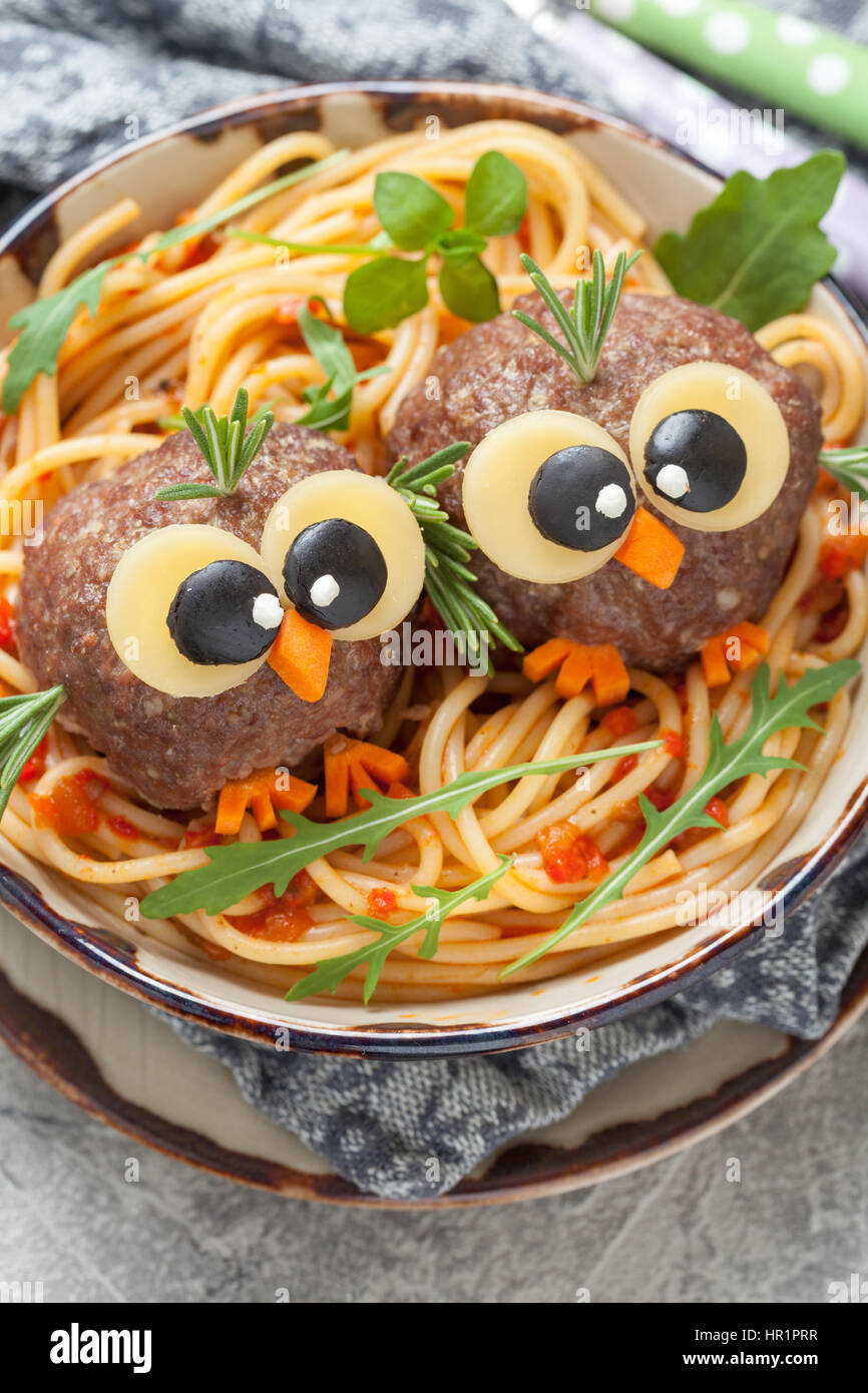 Pasta spaghetti with funny meatballs for kids. Birds in nests Stock ...