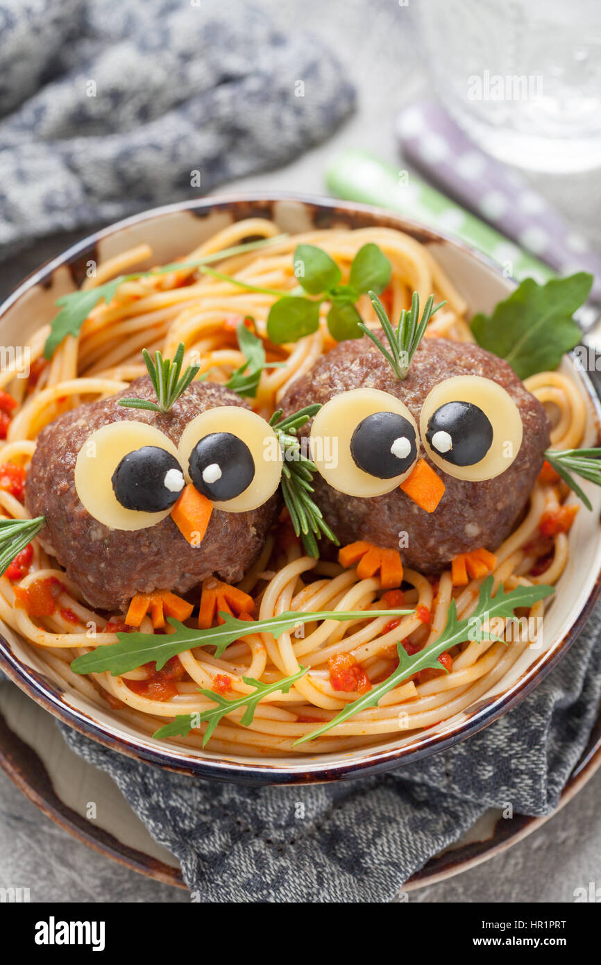 Pasta spaghetti with funny meatballs for kids. Birds in nests Stock ...