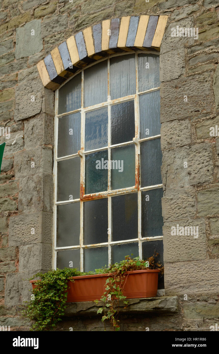 Window with coloured bricks in the arch Stock Photo - Alamy
