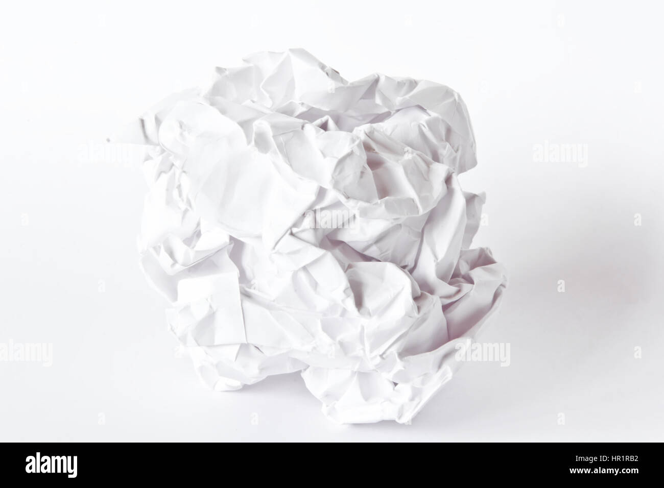 Photo of crumpled paper ball on white background Stock Photo - Alamy