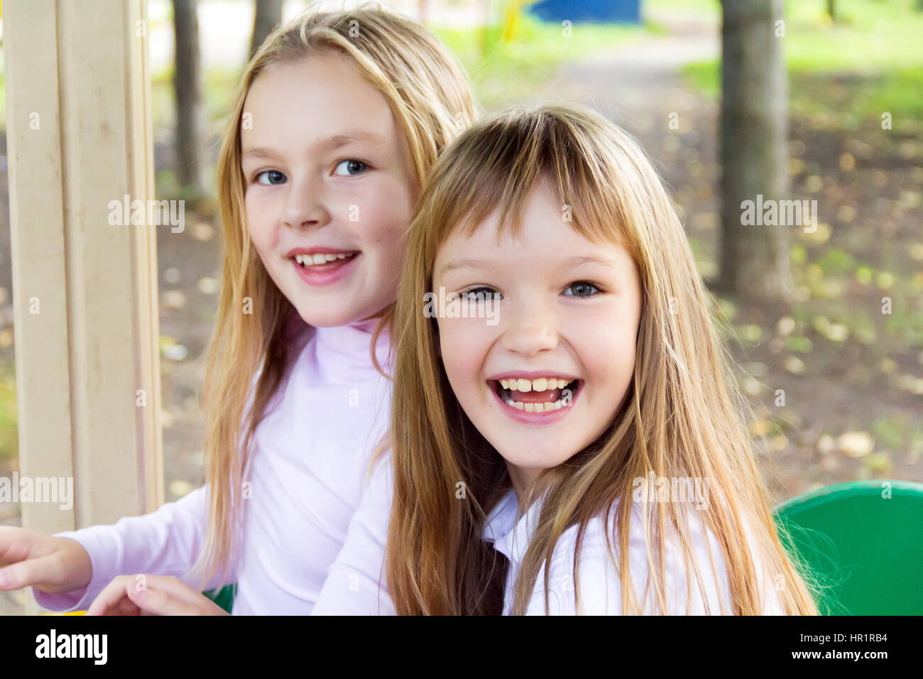 Photo of two playing girls in summer Stock Photo - Alamy