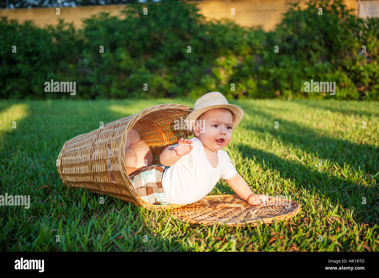 Boy in a basket Stock Photo - Alamy