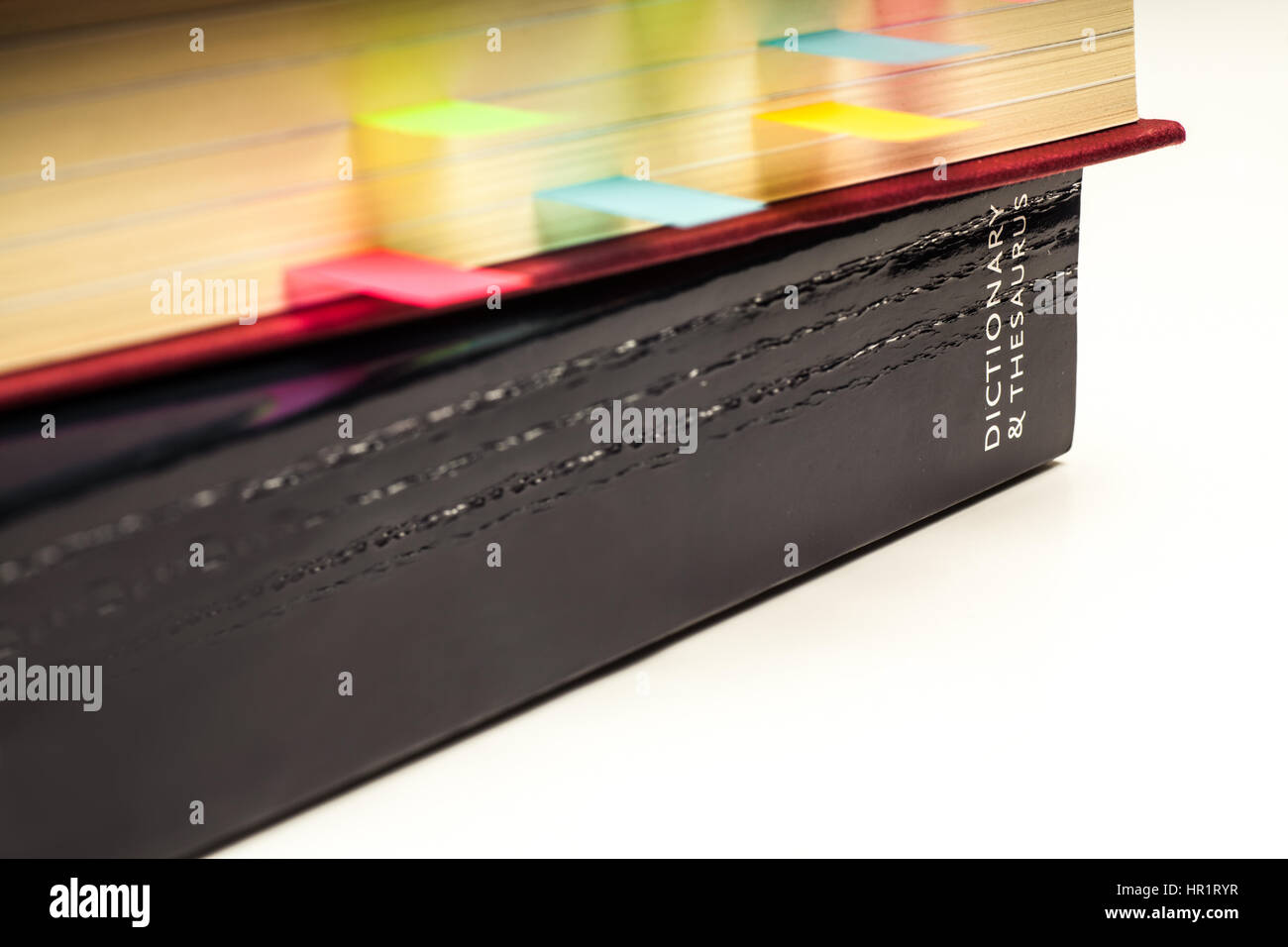 Coloured Sticky Page Markers in a text book and Dictionary Stock Photo ...