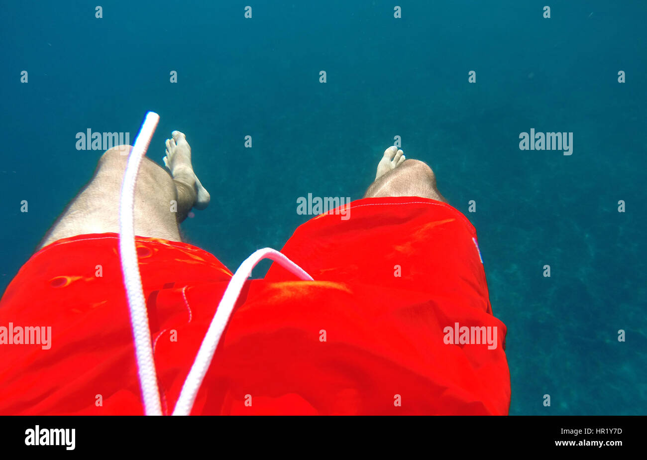Man floating in tropical sea water Stock Photo - Alamy