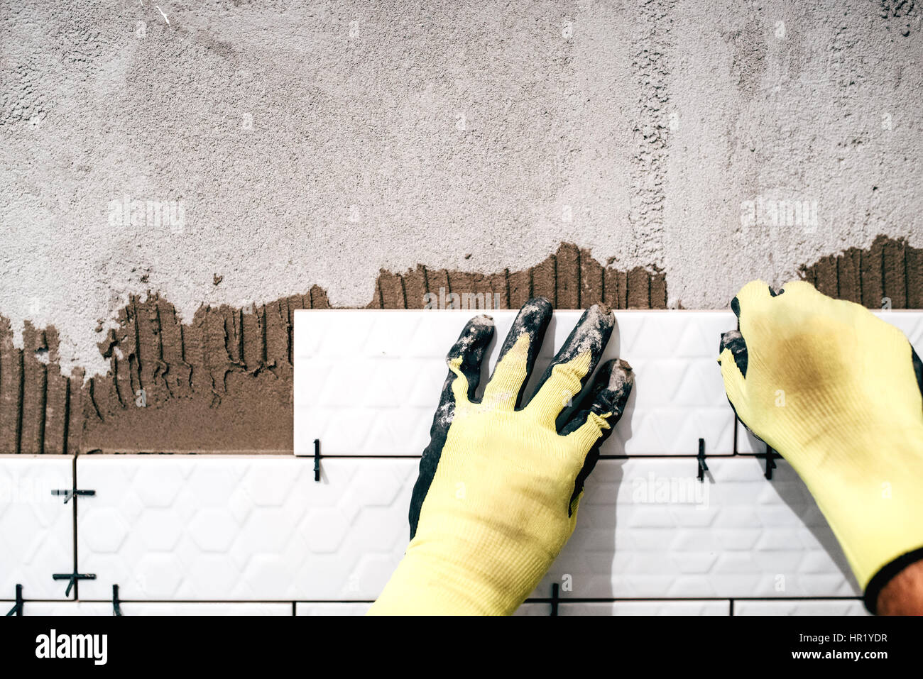 Installing tiles hi-res stock photography and images - Alamy
