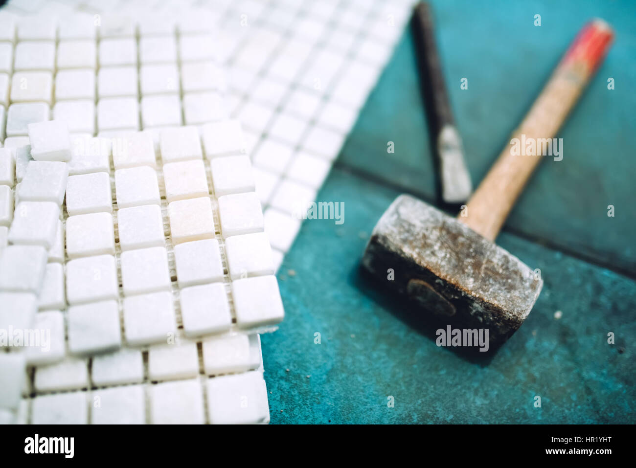 Construction worker laying tile kitchen High Resolution Stock ...