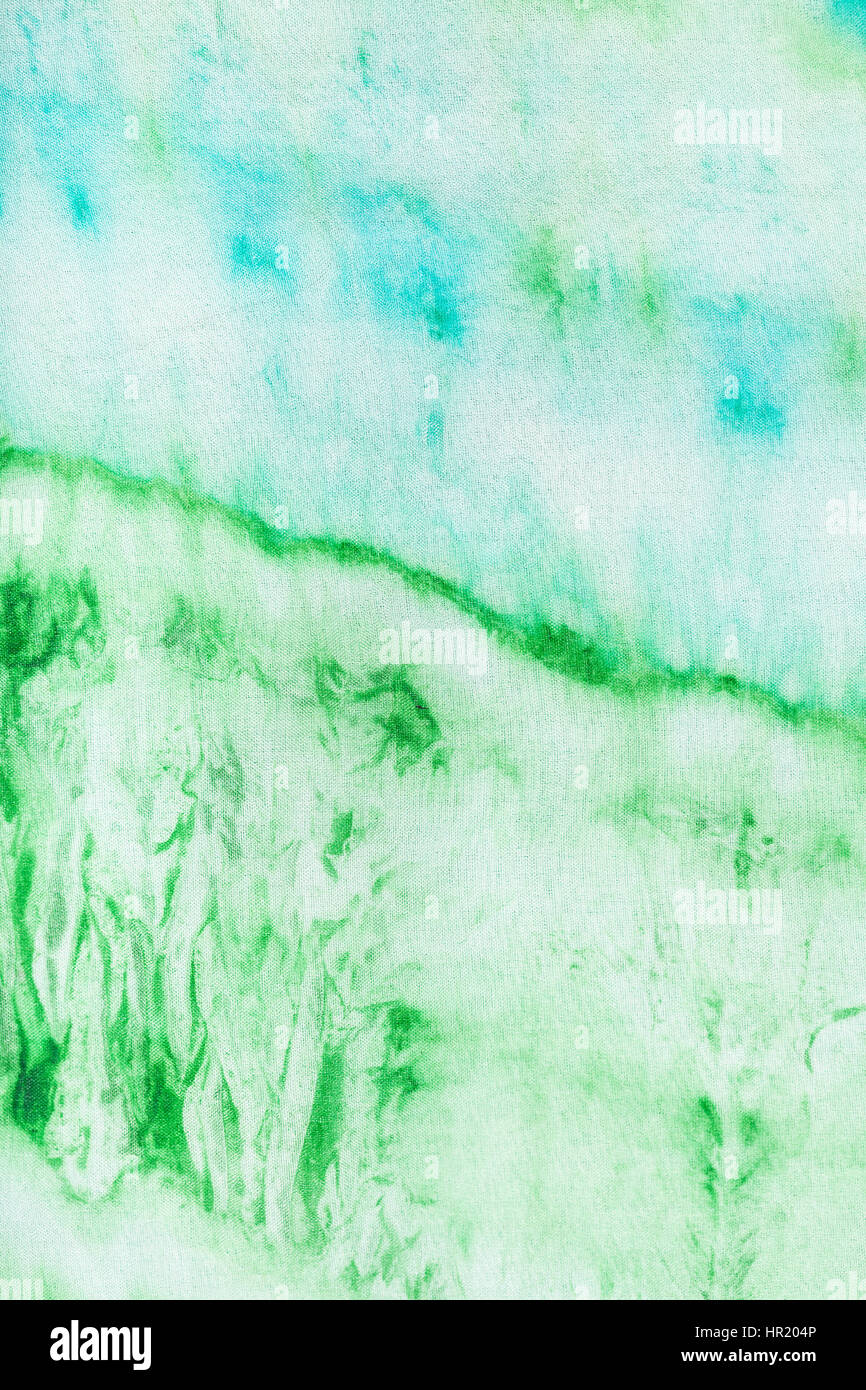textile background - abstract blue and green pattern dyed on silk in ...