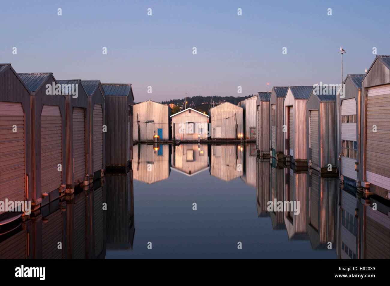 Boathouse reflections in rows along the waterfront at Everett Marina ...