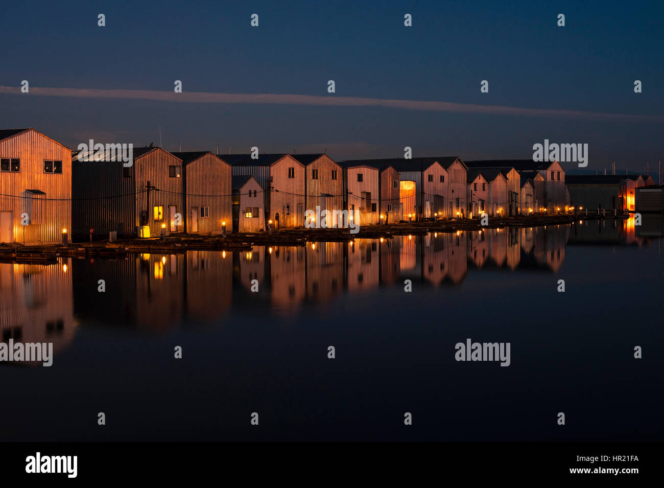 Boathouse reflections at sunrise along the waterfront at Everett Marina ...