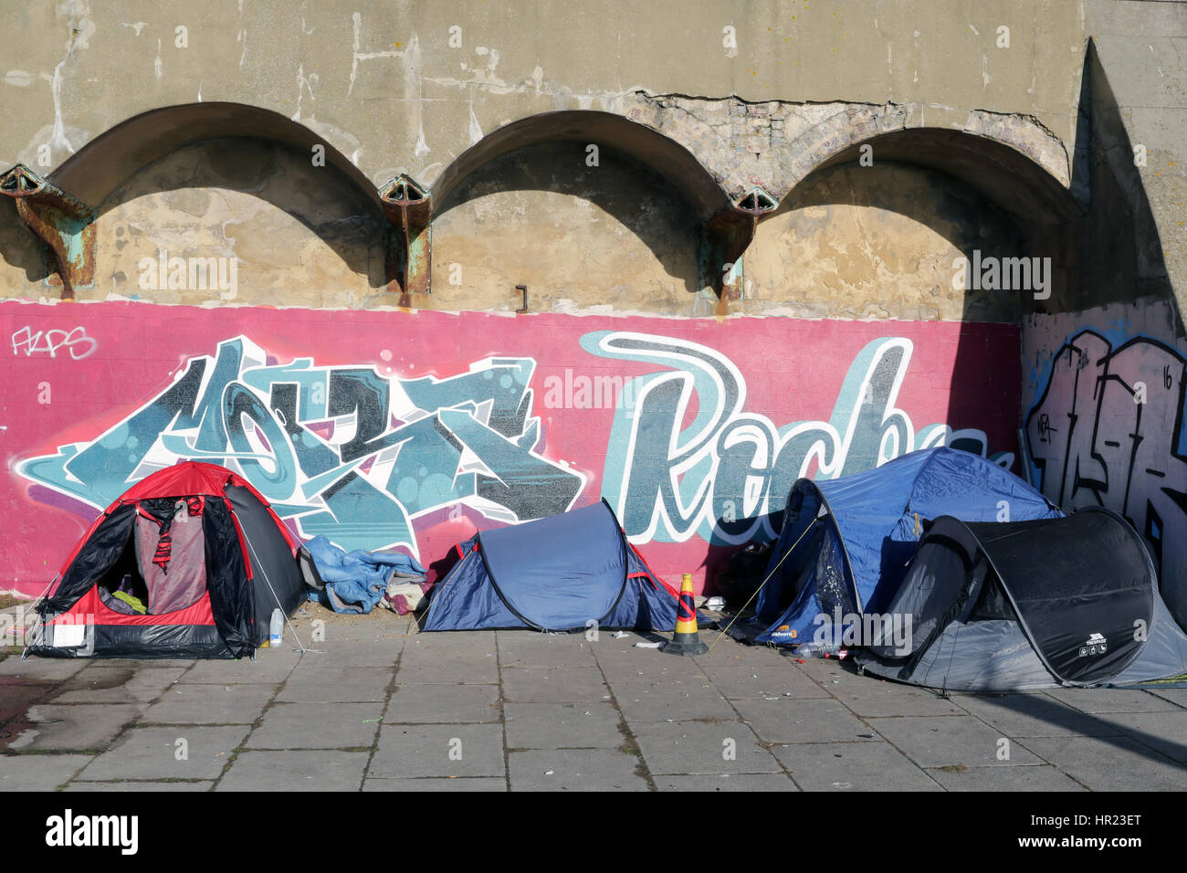 Tents of Homeless people against Graffiti on Brighton Sea Front Stock ...