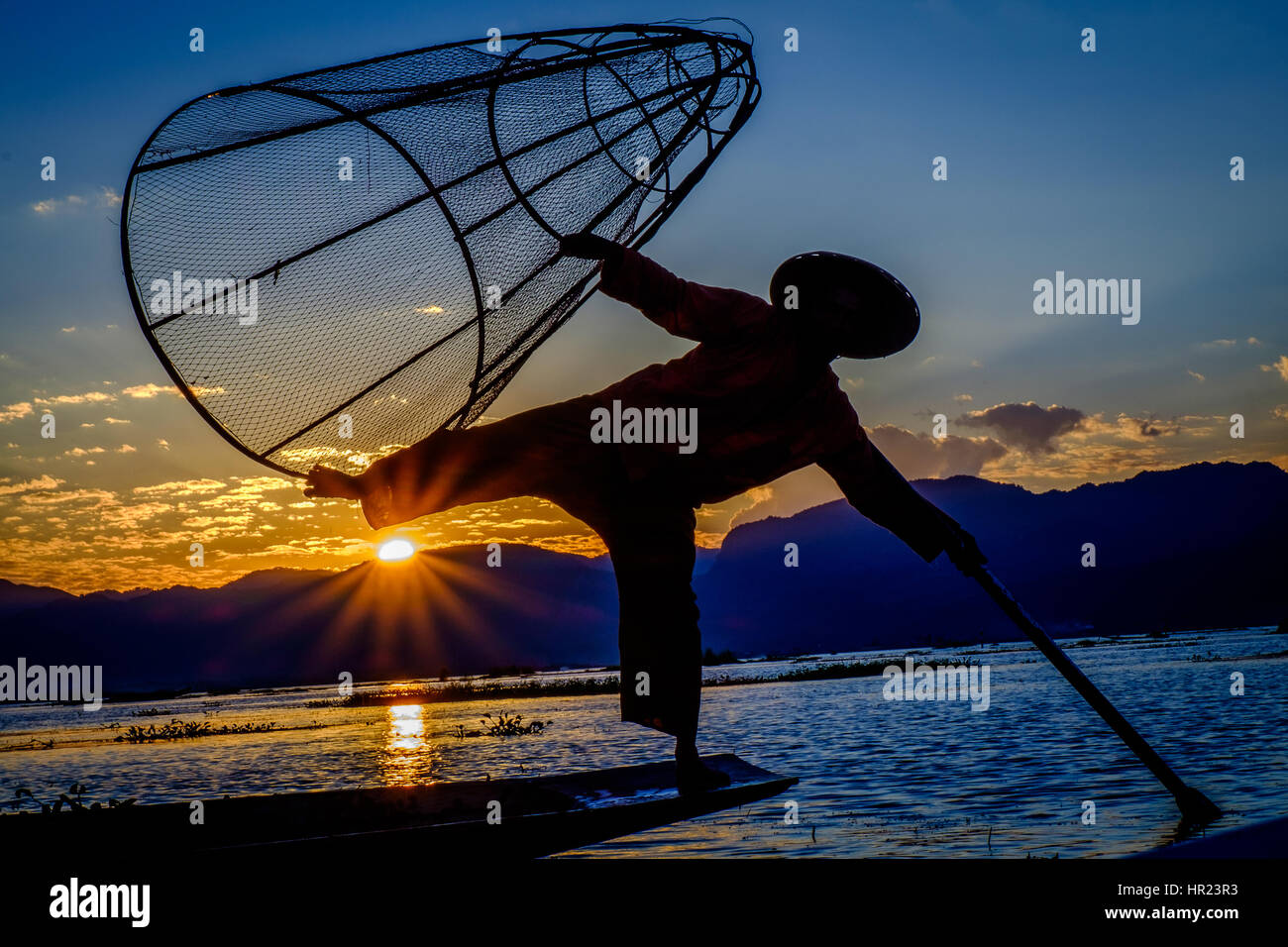 Famous one legged fishermen of Inle Lake, Indein, Myanmar at sunset ...