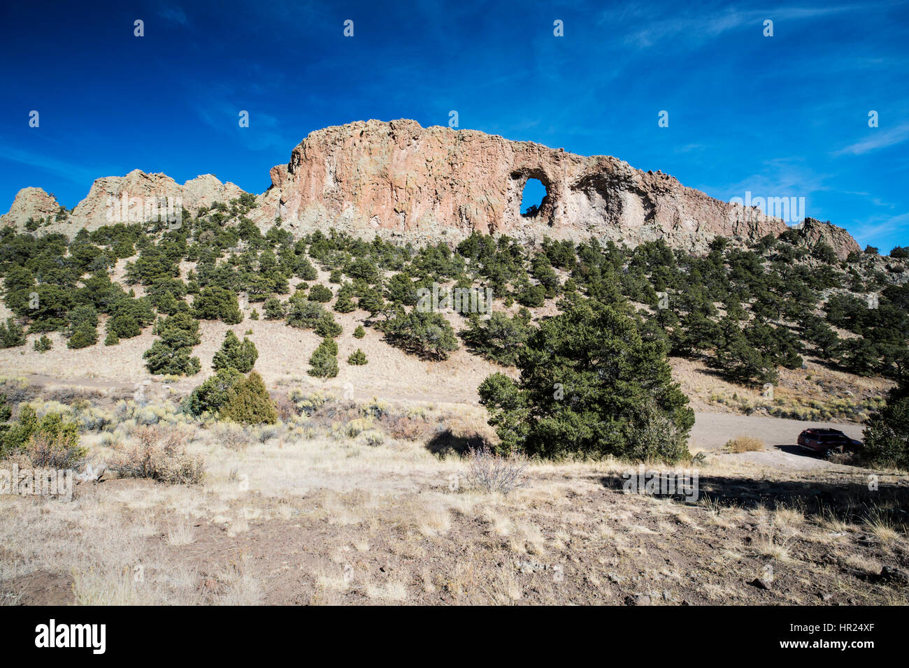 Wide panorama view of Natural Arch rock formation near Penitente Canyon ...