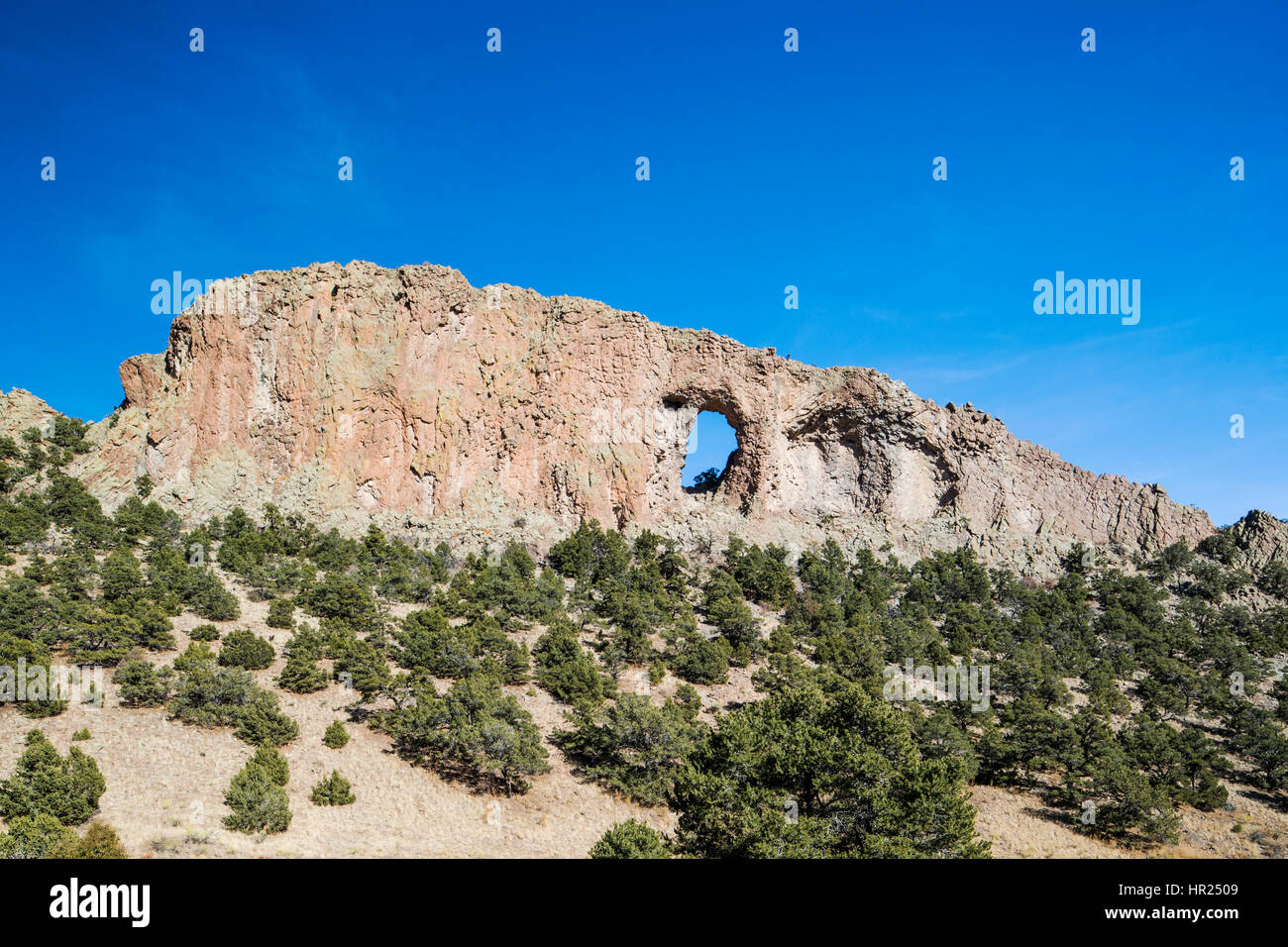Wide panorama view of Natural Arch rock formation near Penitente Canyon ...
