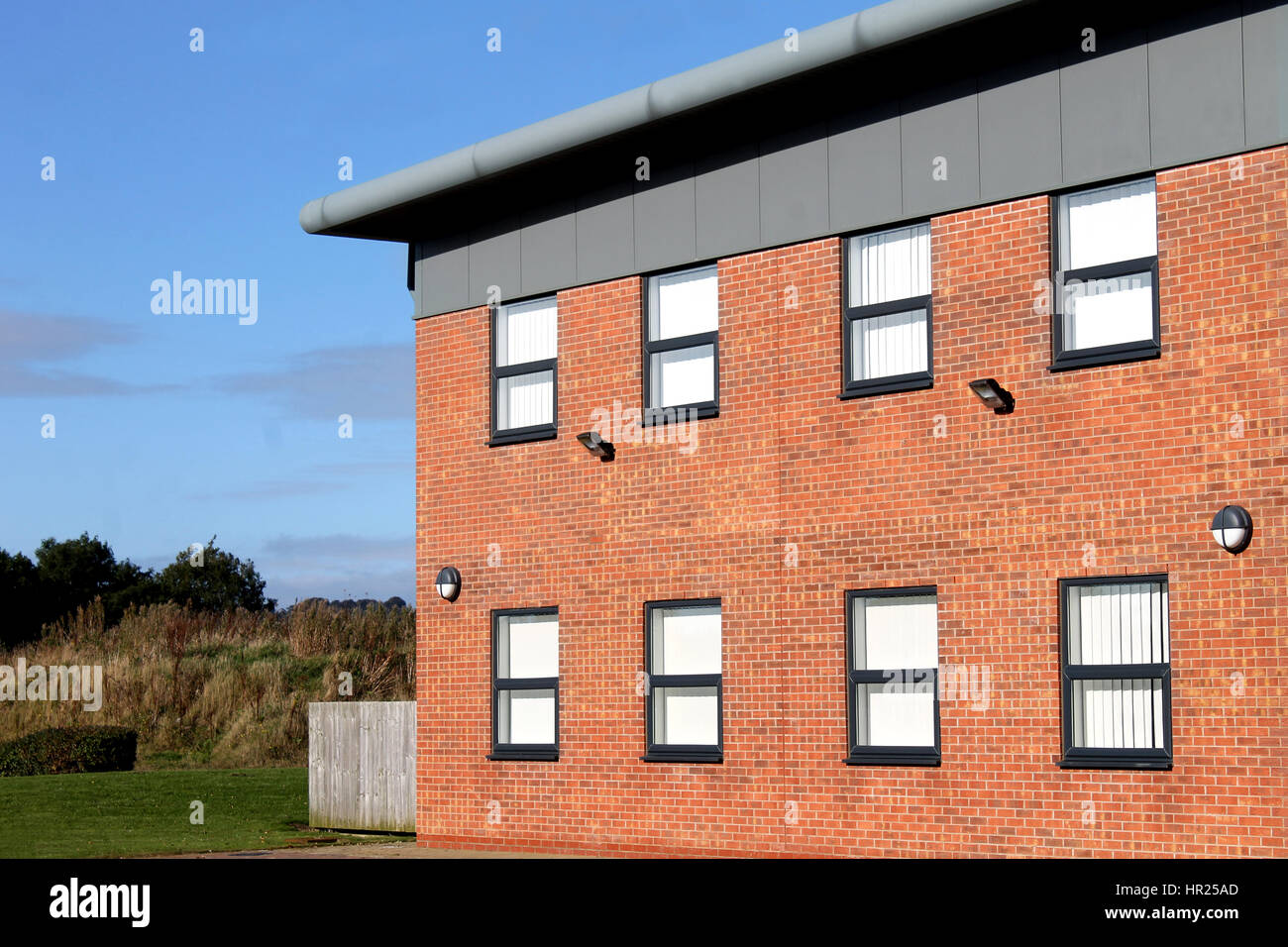 Side view of empty modern office building on business park Stock Photo ...