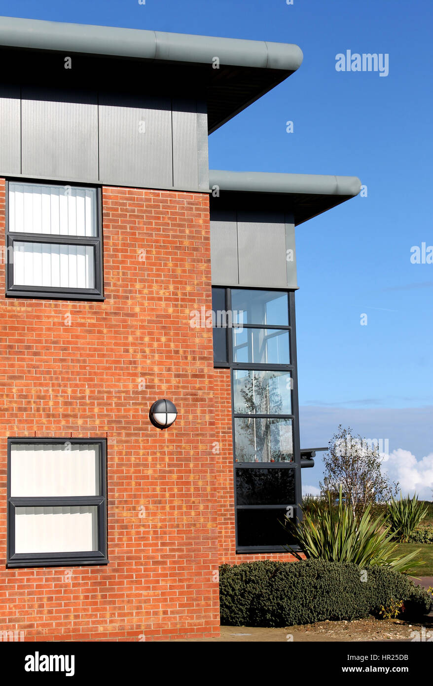 Side view of empty modern office building on business park Stock Photo ...