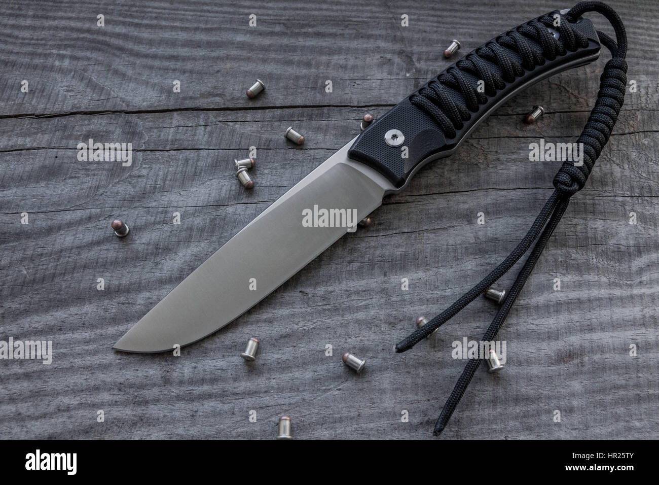 Hunting knife with strap.. Diagonally with bullets Stock Photo - Alamy
