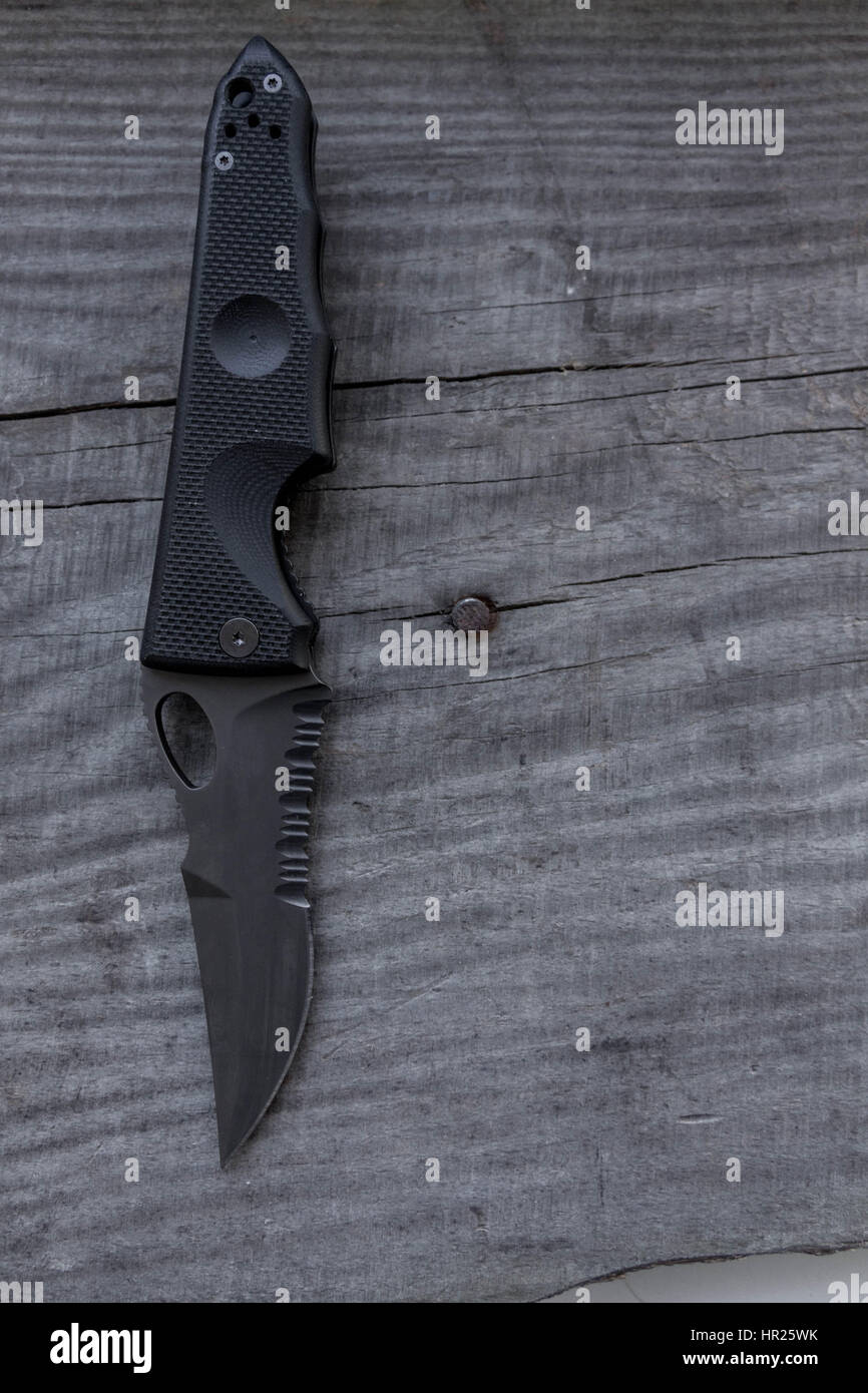 Tactical knife with bullets. Left side. Black knife Stock Photo - Alamy
