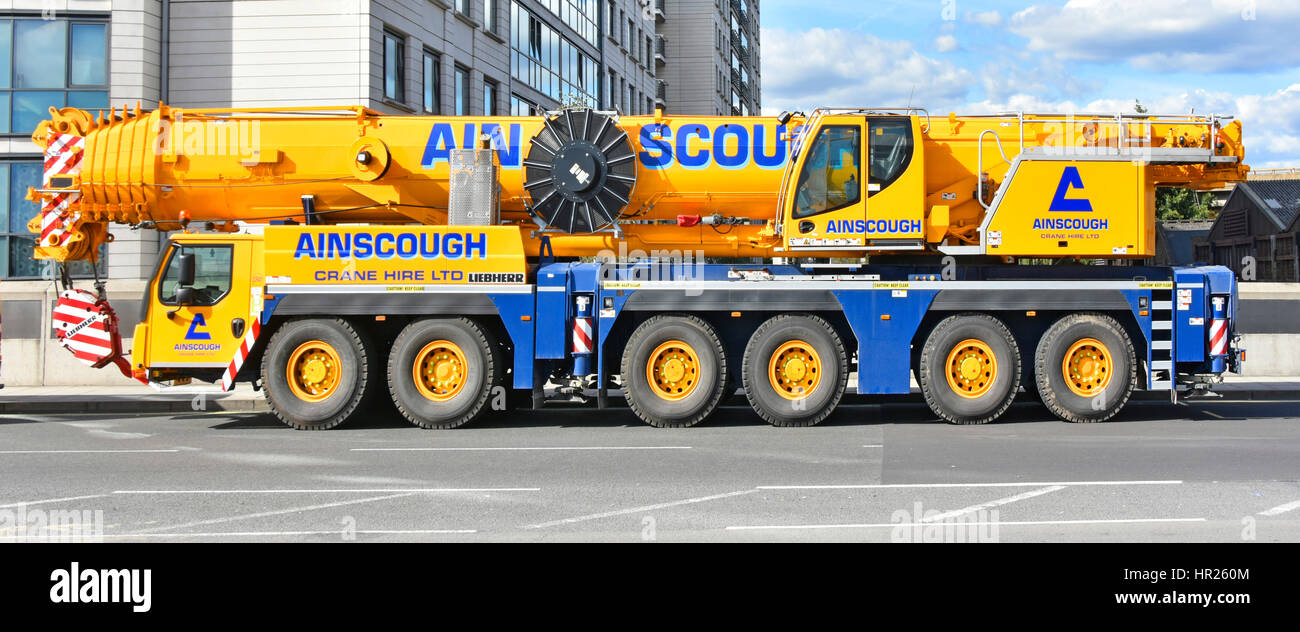 Mobile crane with telescopic boom parked in road waiting to move onto a ...