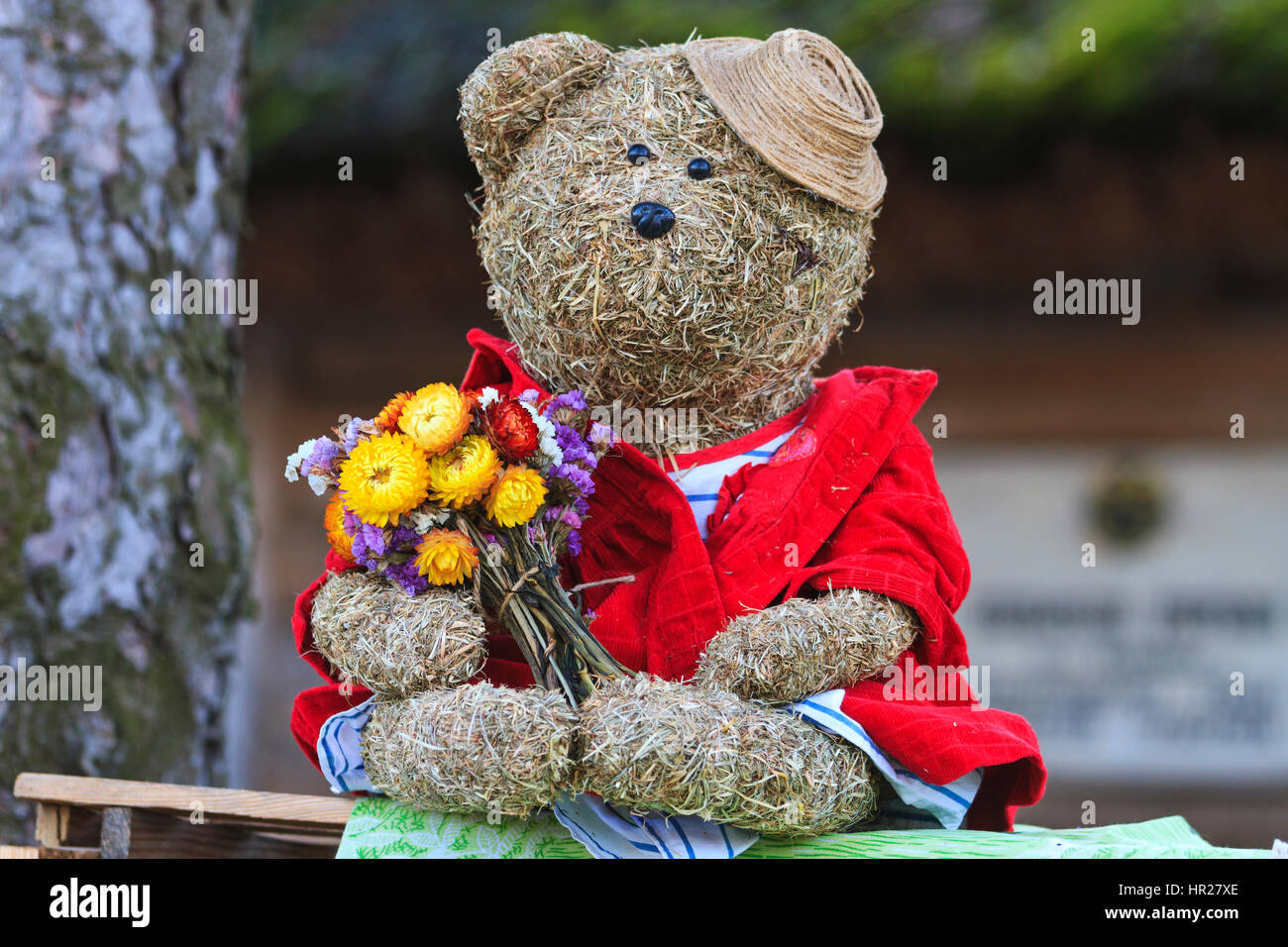 Bear straw holds in paws flowers handmade, natural materials, present ...