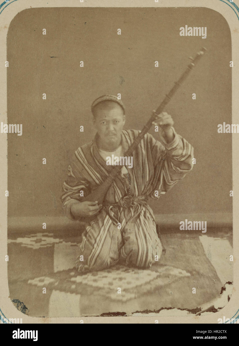 Pastimes of Central Asians. A Musician Playing a Tambur, a Long-necked ...