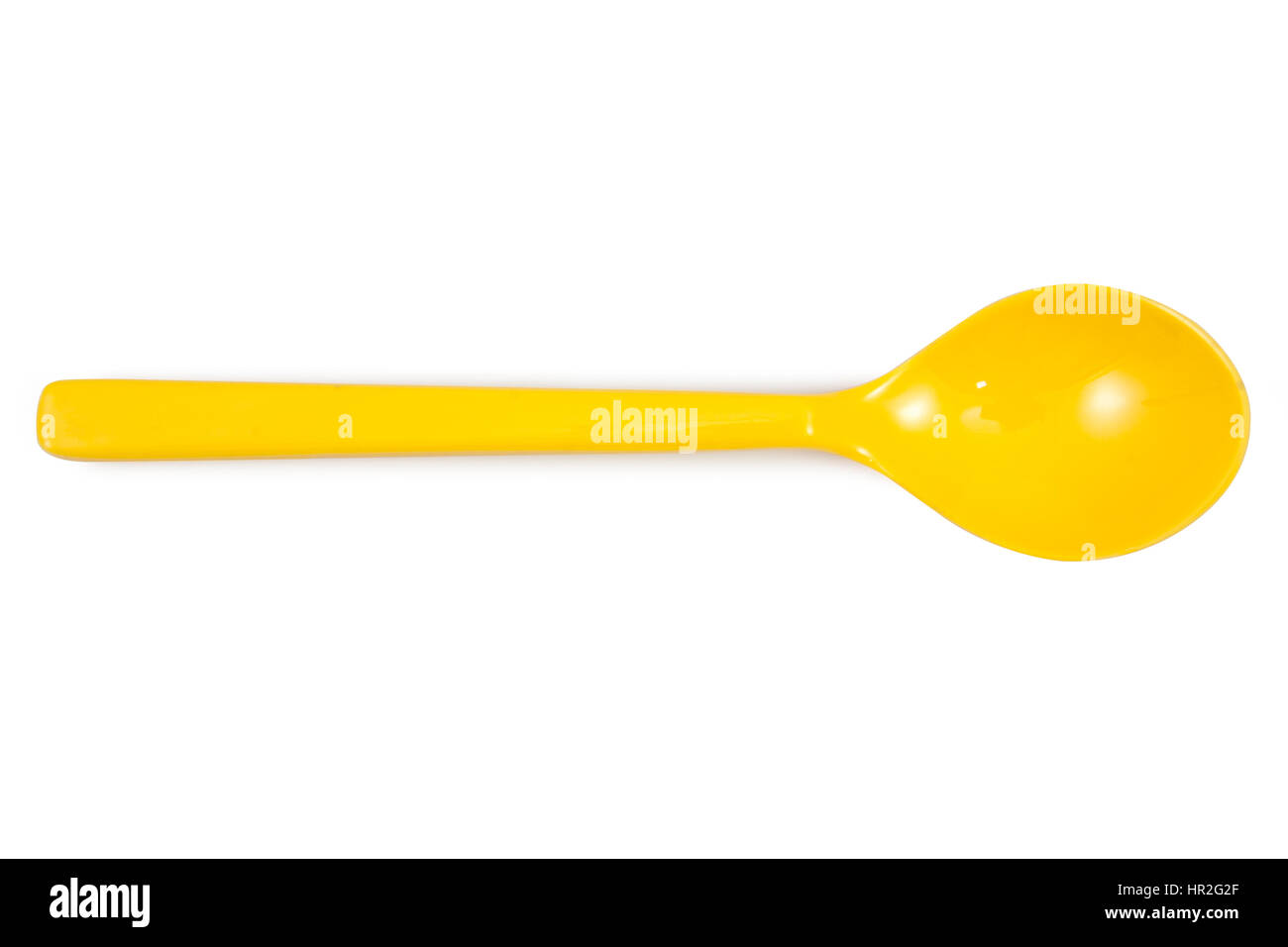 yellow plastic spoon isolated on white background Stock Photo - Alamy