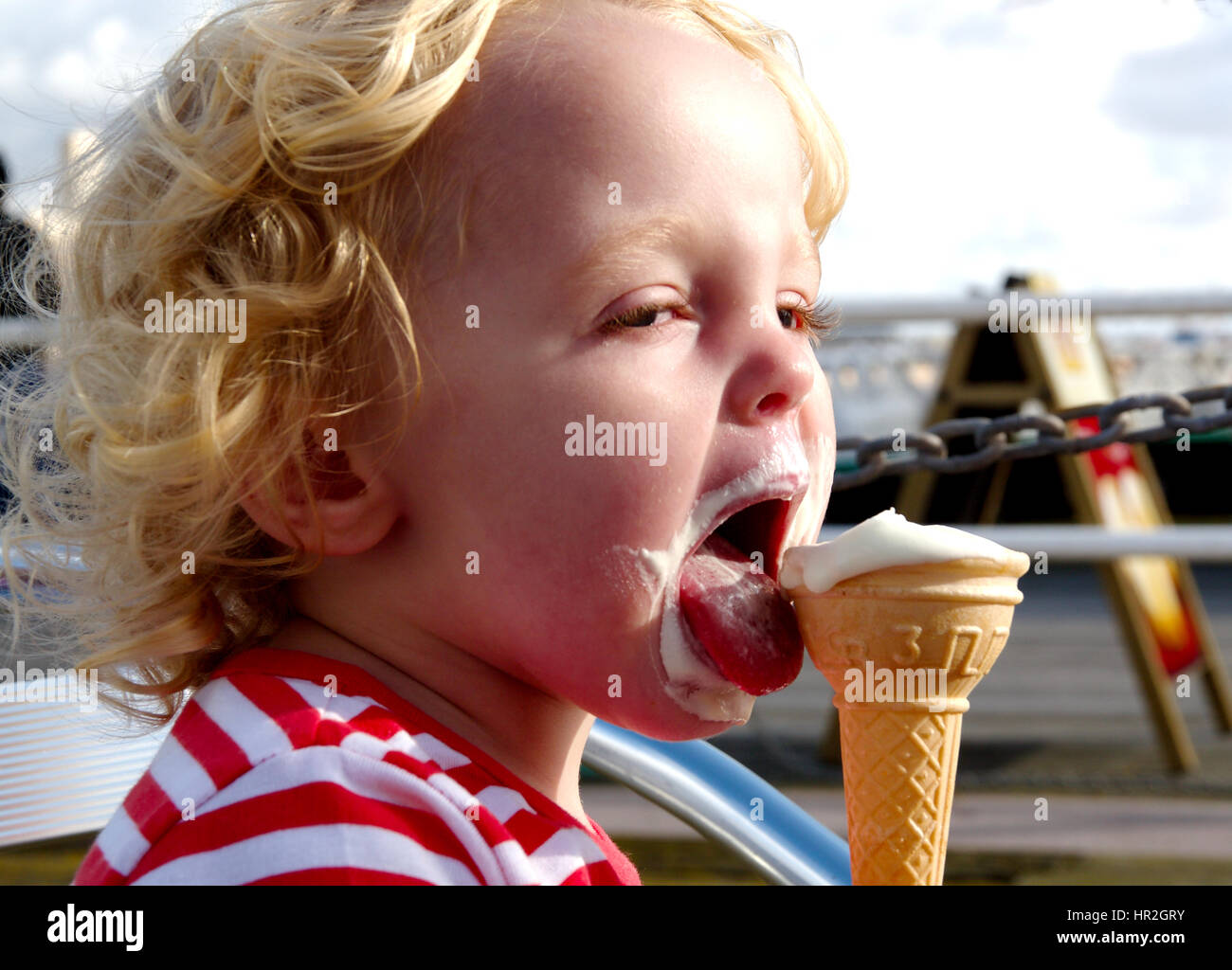 Child eating ice cream Stock Photo - Alamy