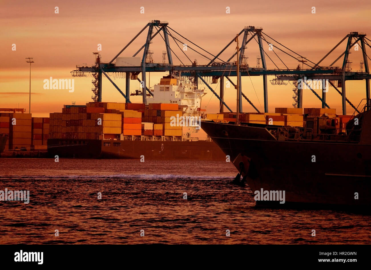 cargo boat by the beach at sunset time in beautiful colours Stock Photo ...