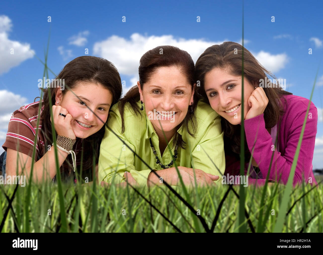 Happy Family portrait outdoors in a park where all are smiling Stock ...