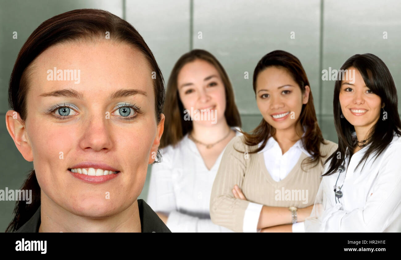 beautiful business woman and her team in an office - female only Stock ...
