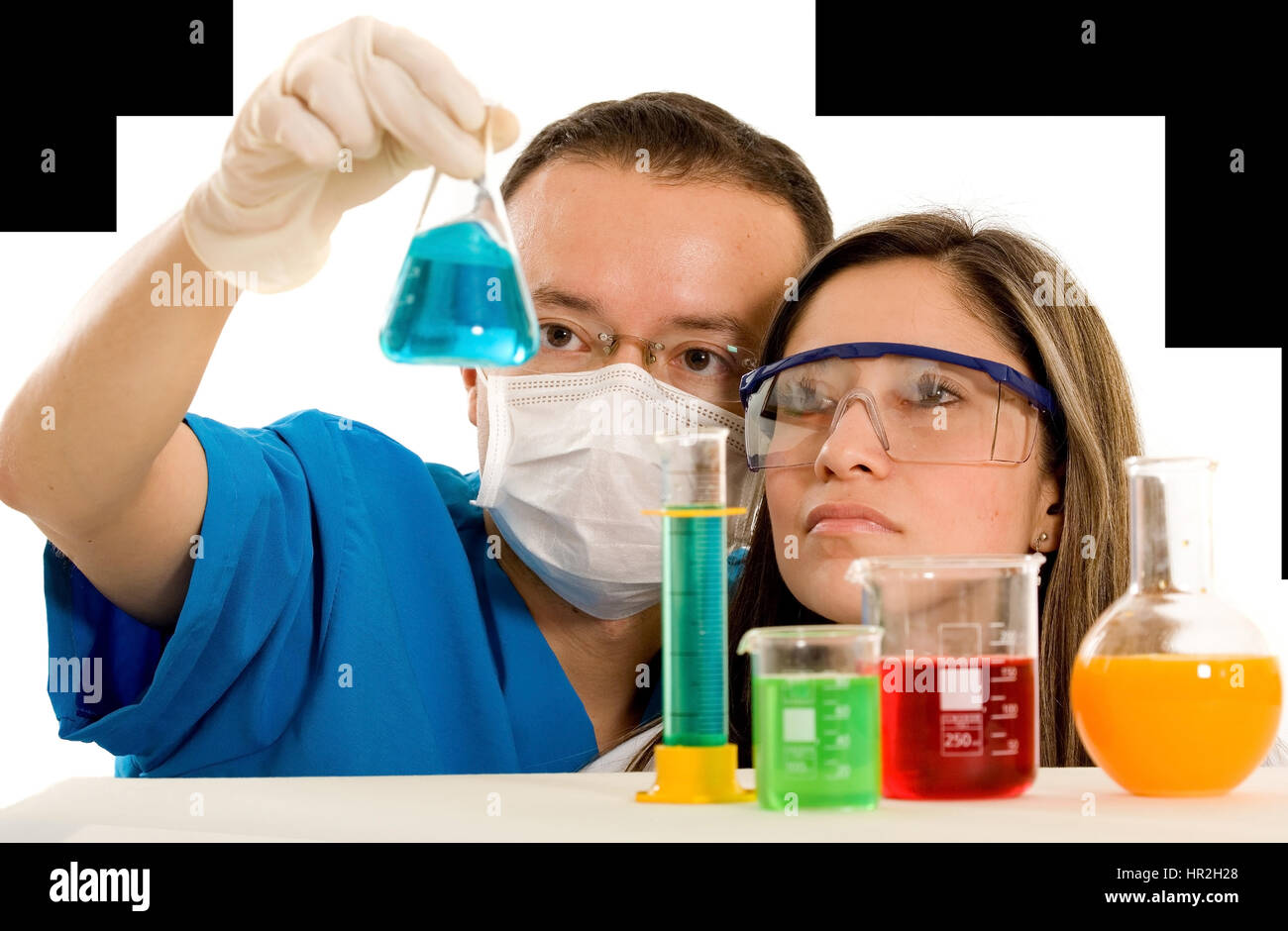 Couple of young chemistry students over a white background Stock Photo ...
