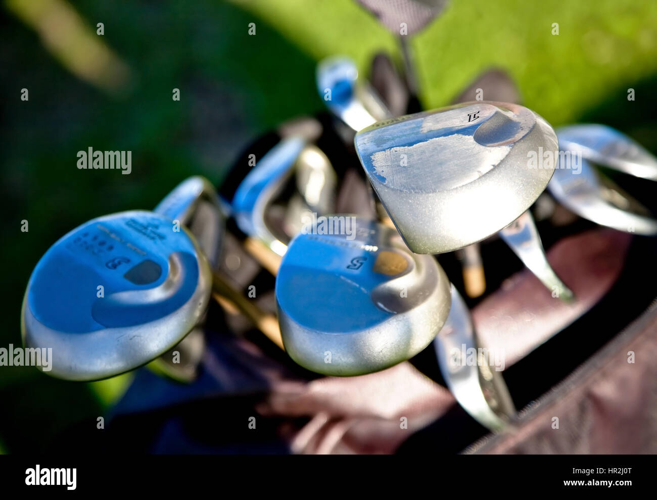 abstract golf clubs with green grass in the background Stock Photo - Alamy