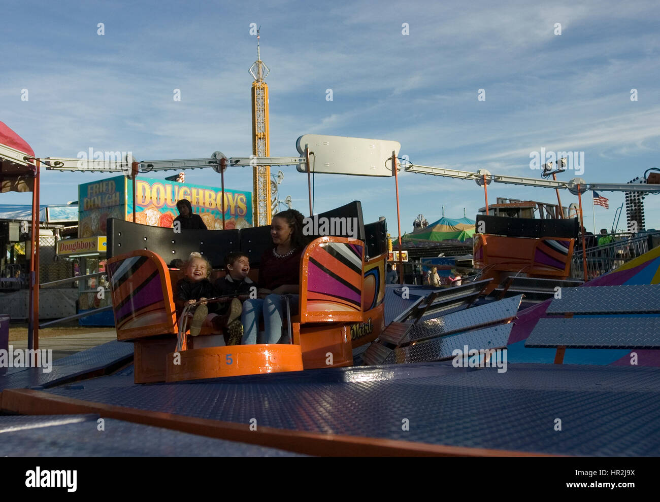 Carnival riders, Deerfield Fair, Deefield, New Hampshire on an October ...